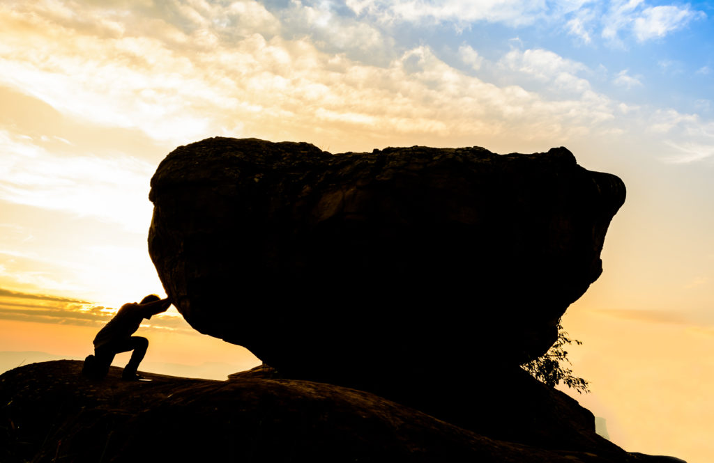 Hard work.The person rolls the rock on mountain. - Professional Motor ...